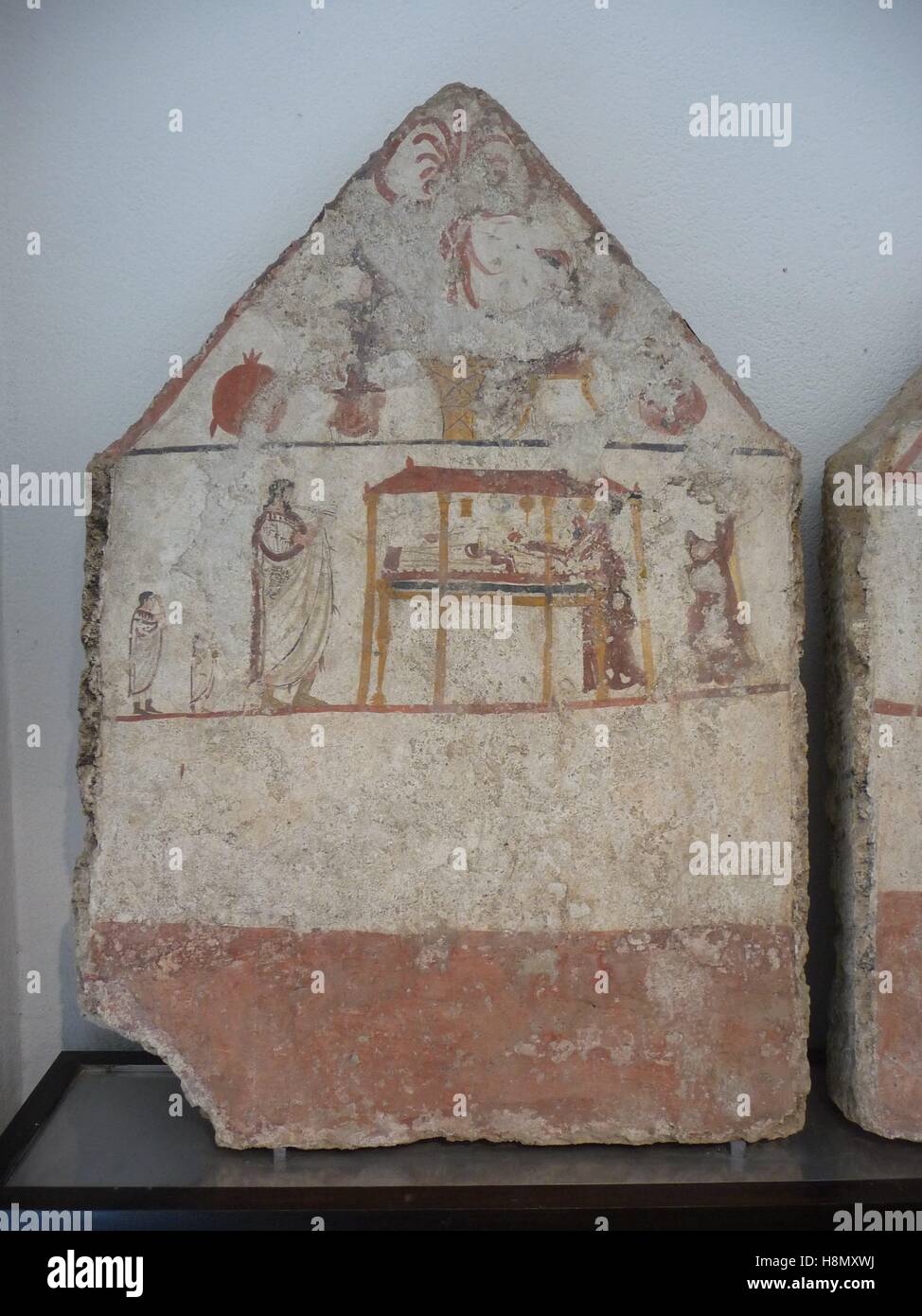 Painted tomb slab in the museum at the archeological site of Paestum in ...