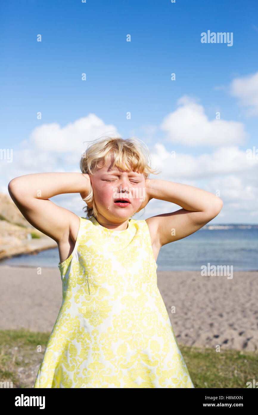 Girl (4-5) crying on beach Stock Photo - Alamy