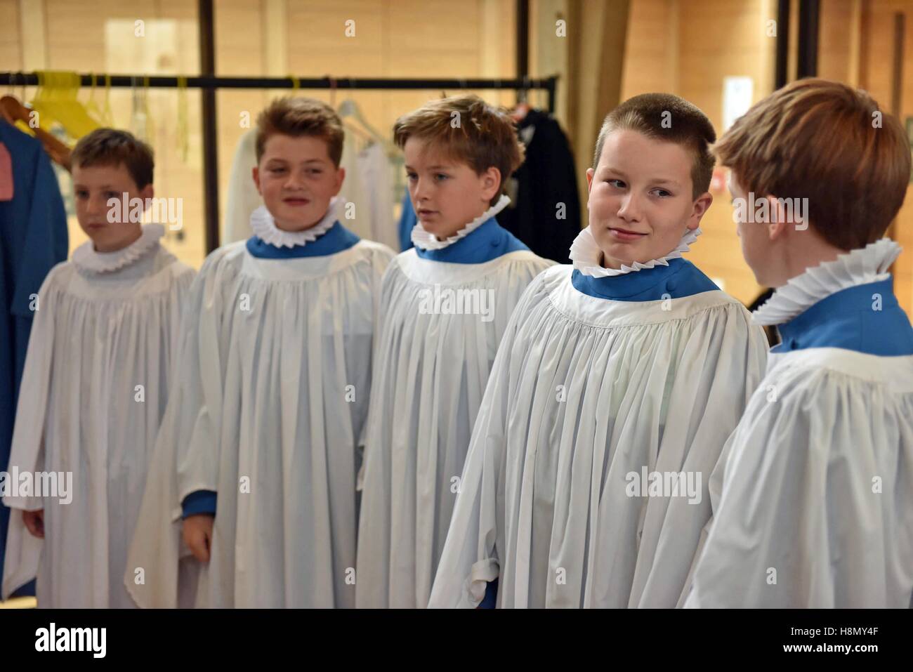Five boy choristers at cassock fitting before first evensong of the ...