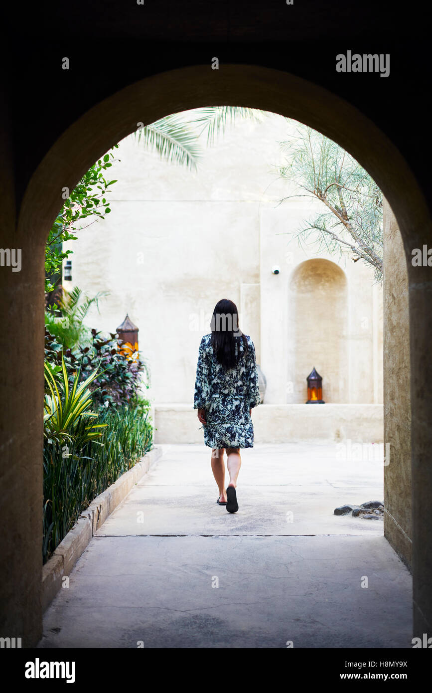 Woman on walkway seen from arch Stock Photo - Alamy