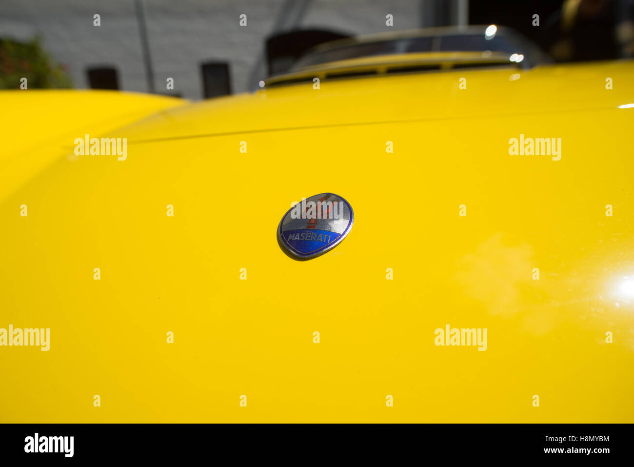 Yellow Maserati Mistral Bonnet and trident badge Stock Photo - Alamy
