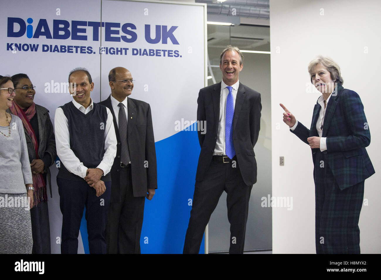 Prime Minister Theresa May speaks to volunteers and staff members ...