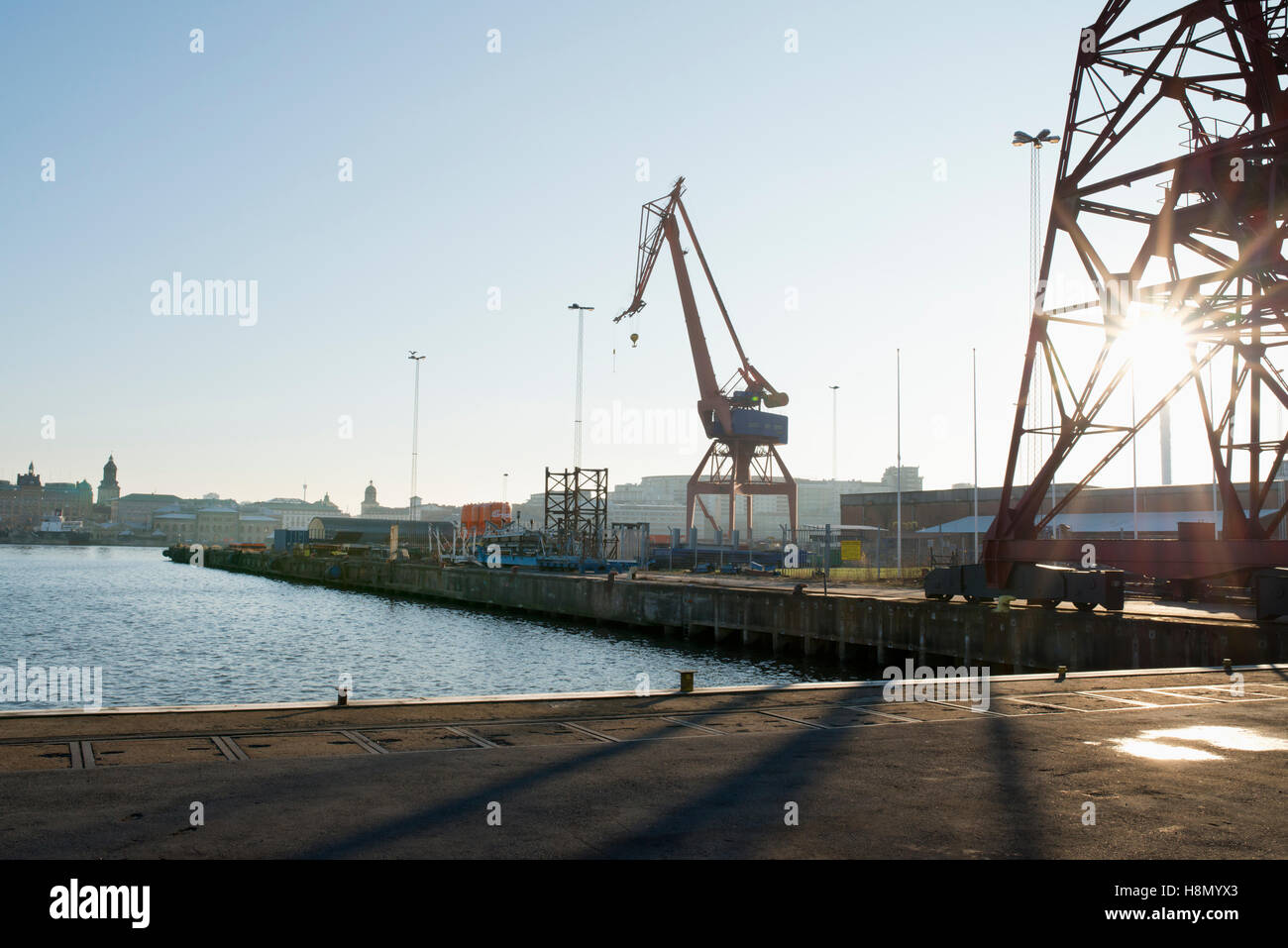 Crane in dock at sunset hi-res stock photography and images - Alamy