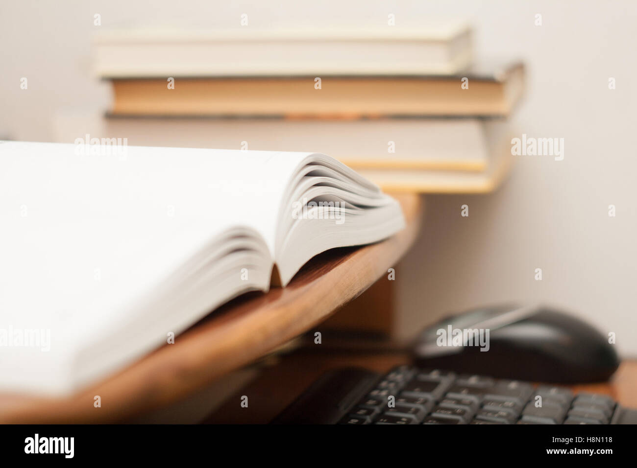 Open book on a work table Stock Photo - Alamy