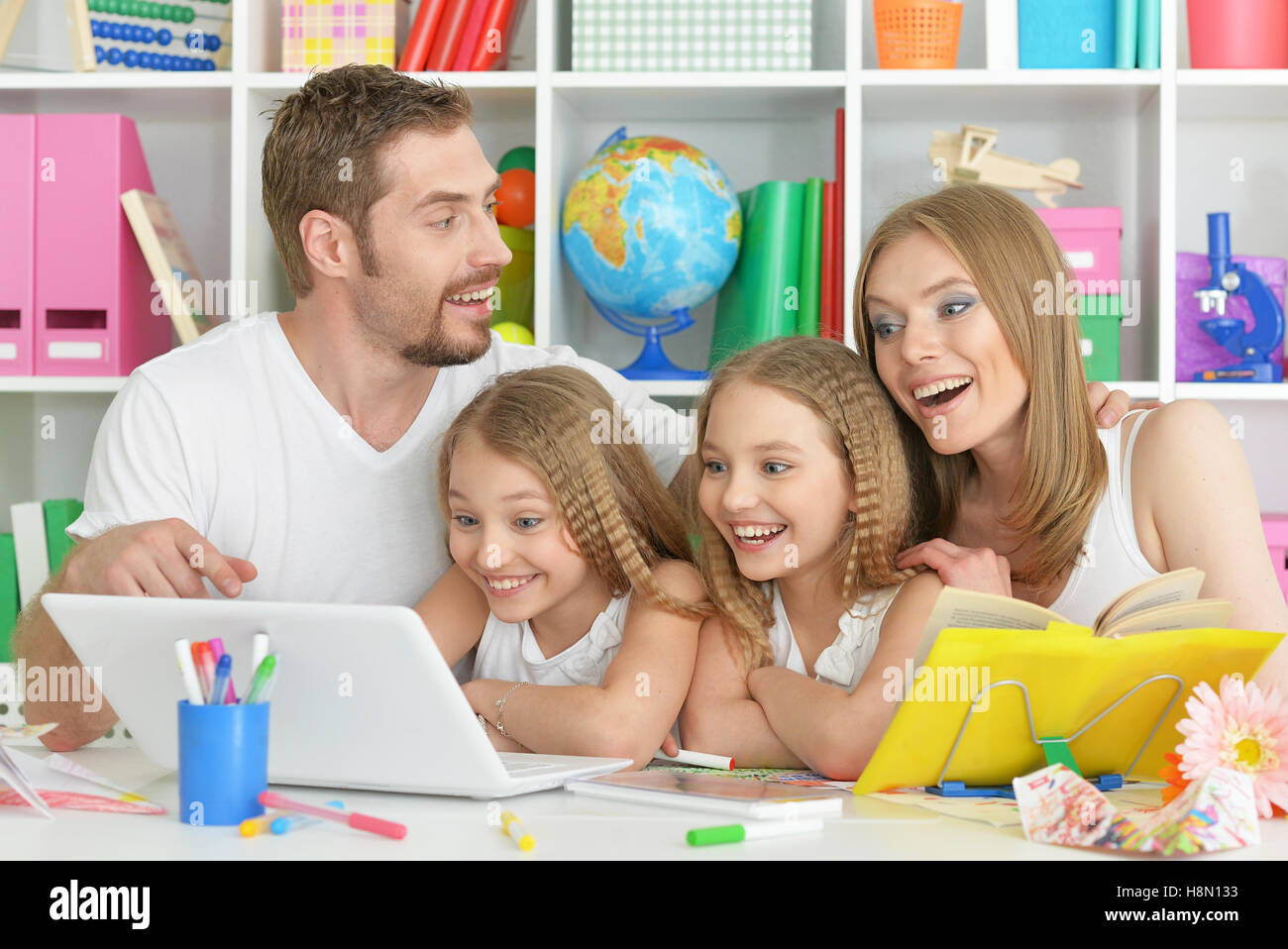 happy family with laptop Stock Photo - Alamy