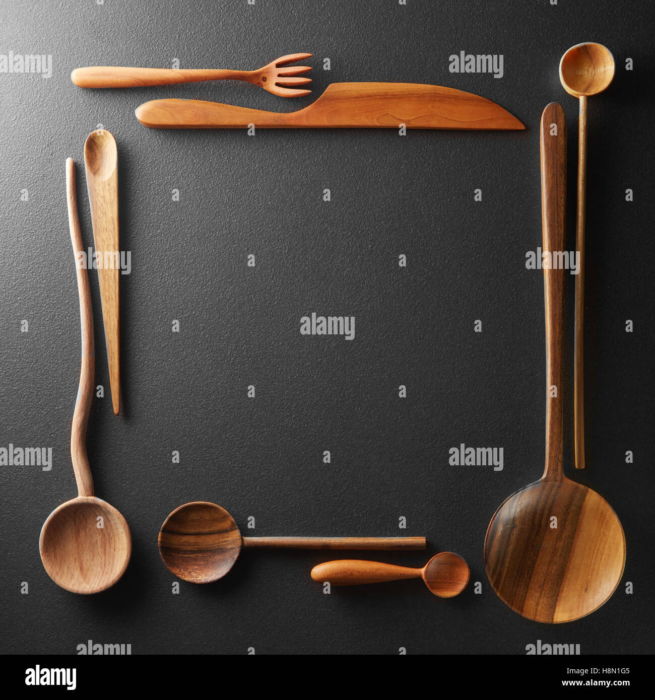 frame of wooden spoons, forks and a knife Stock Photo - Alamy