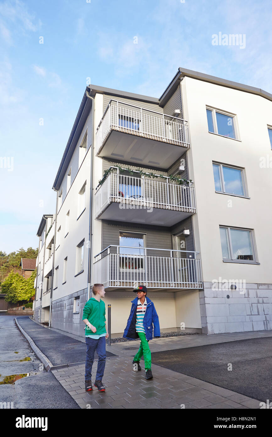 Two boys talking street hi-res stock photography and images - Alamy