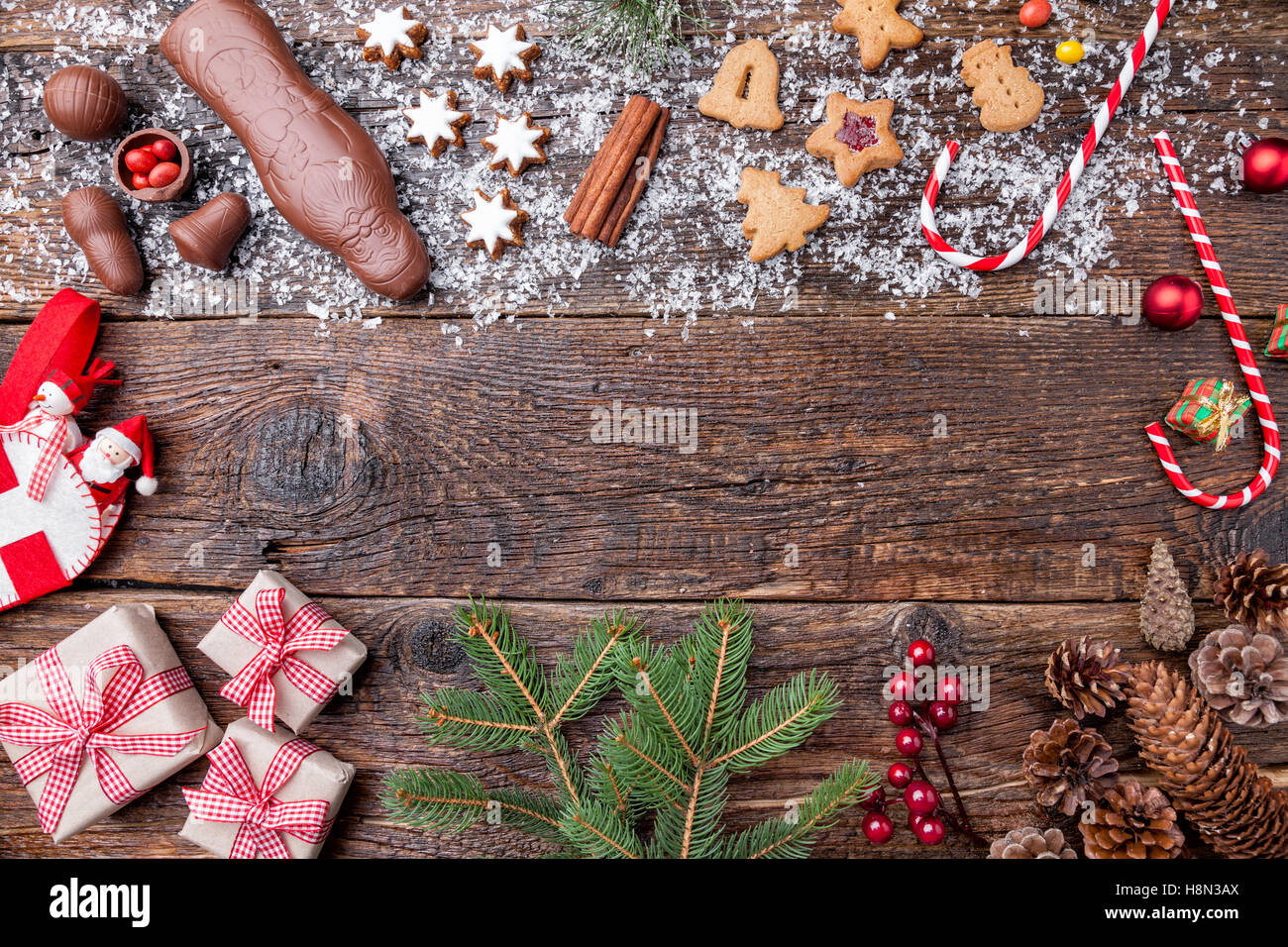Festive Christmas wooden background with sweets and decoration Stock ...