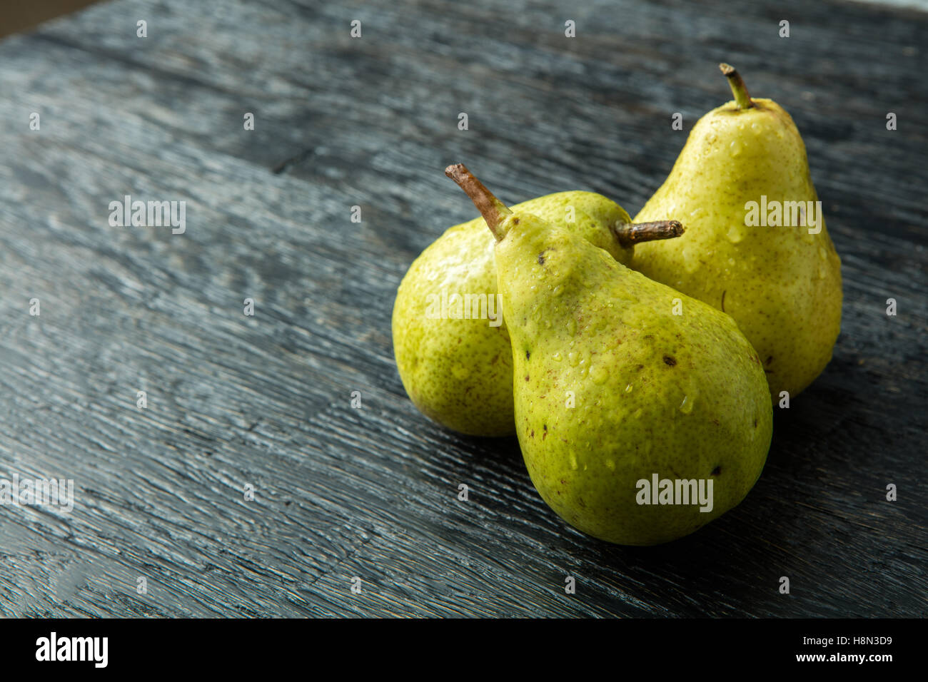 Three green pears Stock Photo - Alamy