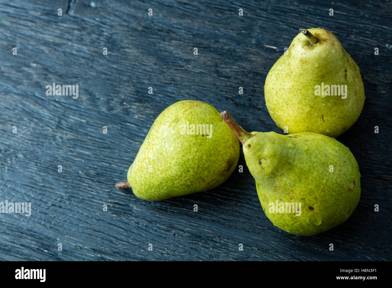 Three green pears Stock Photo - Alamy