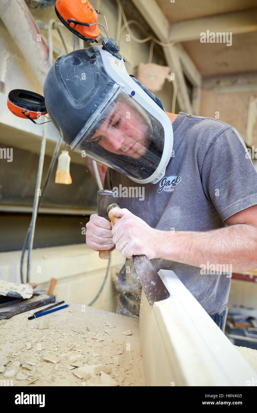 A stonemason shapes part of a frieze in a workshop Stock Photo - Alamy