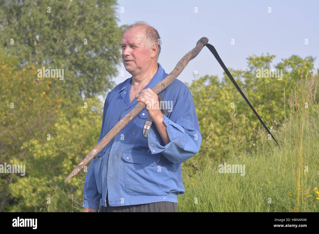a man with a scythe Stock Photo - Alamy