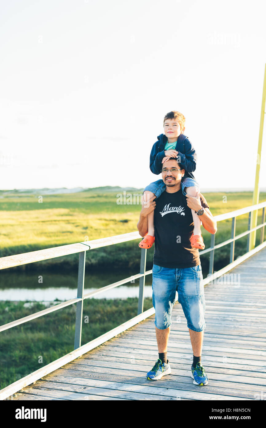 Father giving piggy back ride to his son hi-res stock photography and images - Alamy