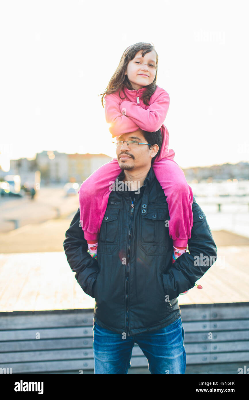 Kid in the shoulders of his father hi-res stock photography and images ...