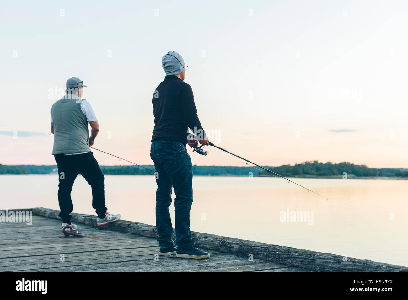 Two males fishing hi-res stock photography and images - Alamy