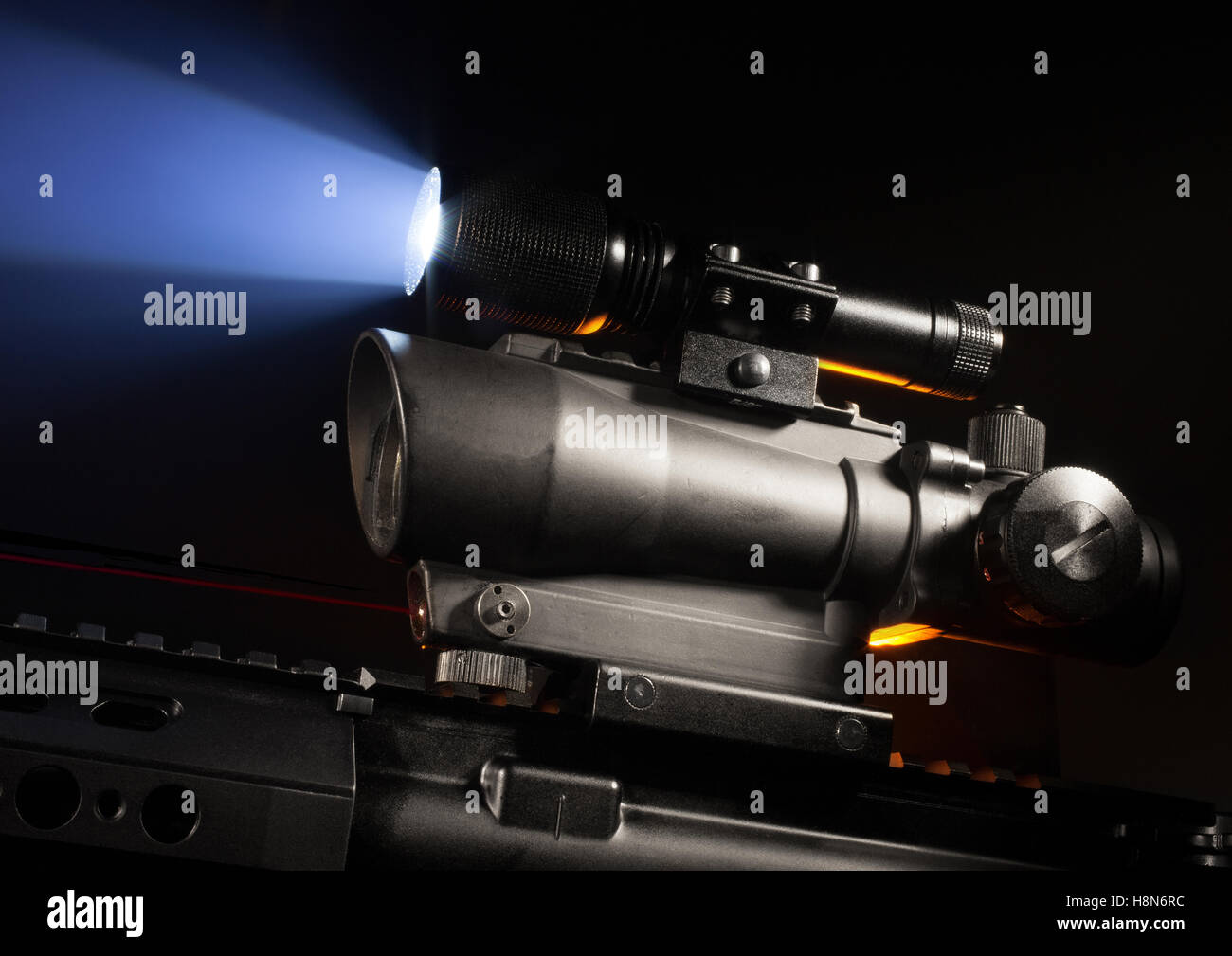 Scope designed for a rifle with a laser and flashlight Stock Photo - Alamy