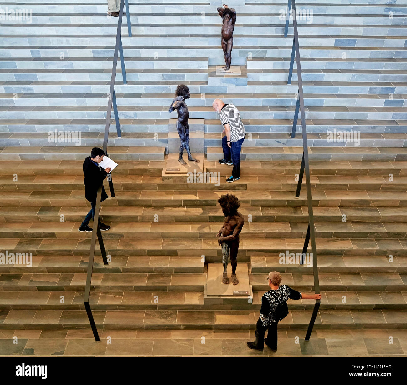 Interior staircase with Stone Age Man replicas and visitors. Moesgaard ...