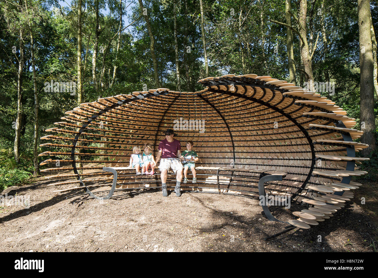 View of front of pavilion and people sitting on bench. Perspectives ...