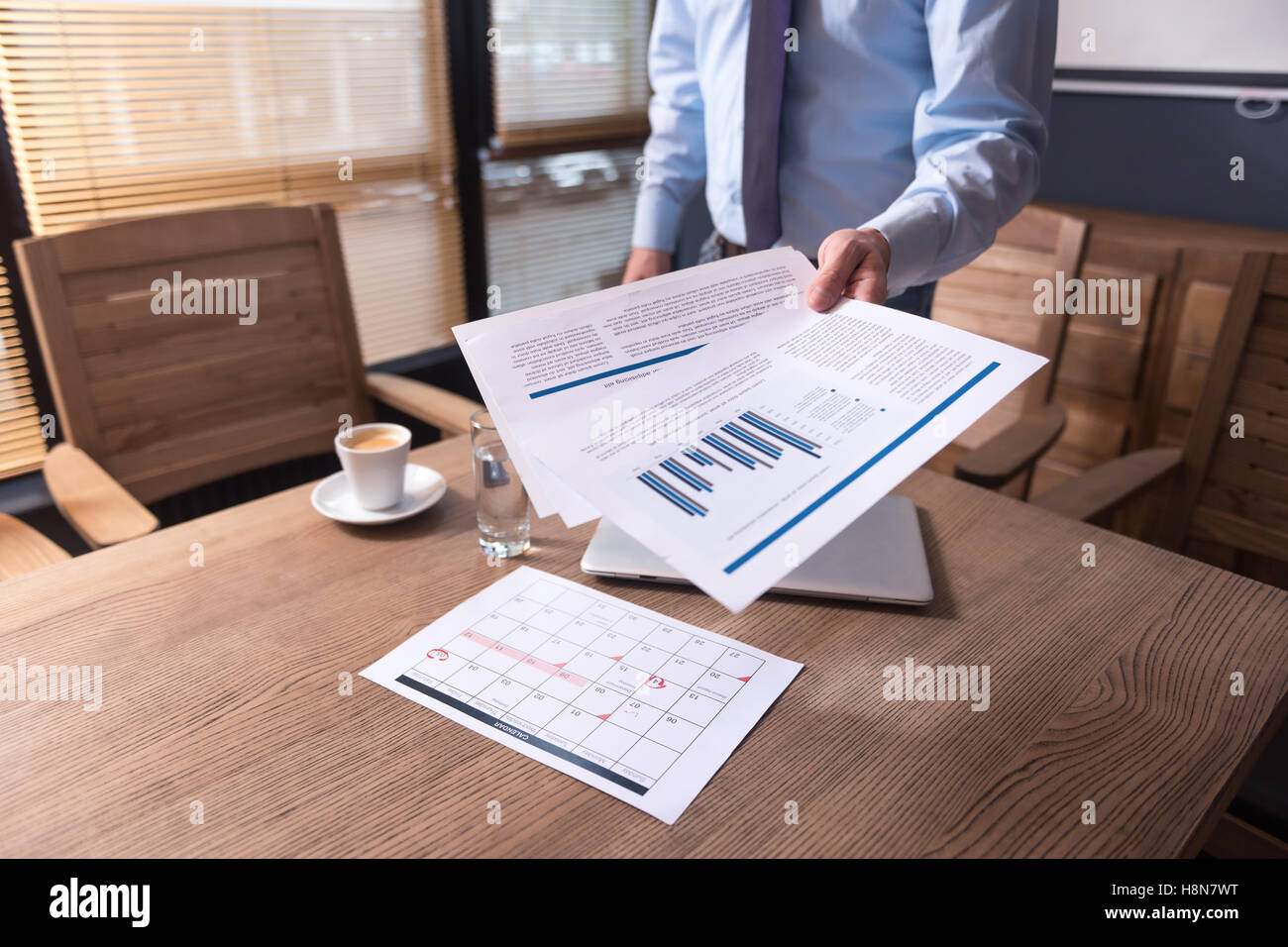 Documents being in hands of the office worker Stock Photo - Alamy