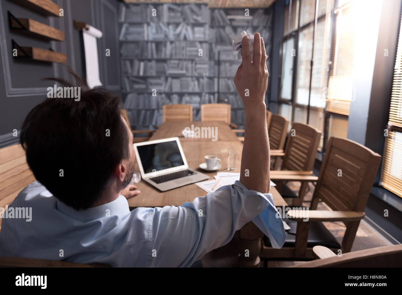 Cheerful happy man throwing a paper ball Stock Photo - Alamy