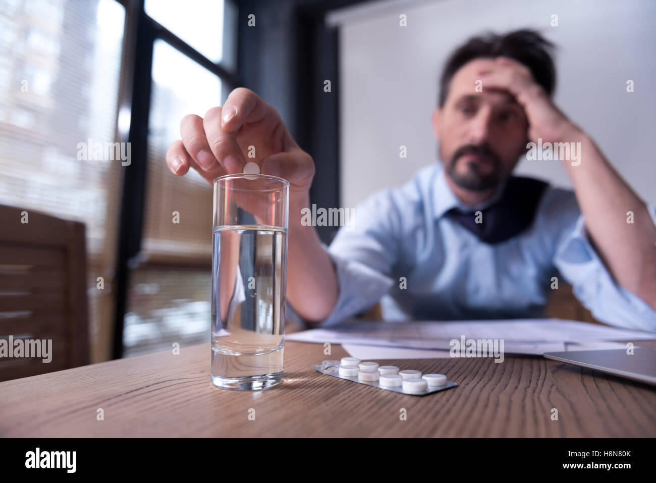 Man taking medicine hi-res stock photography and images - Alamy