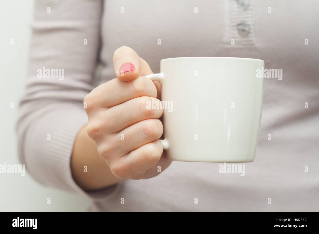 Woman hands holding cup of tea or coffee Stock Photo - Alamy