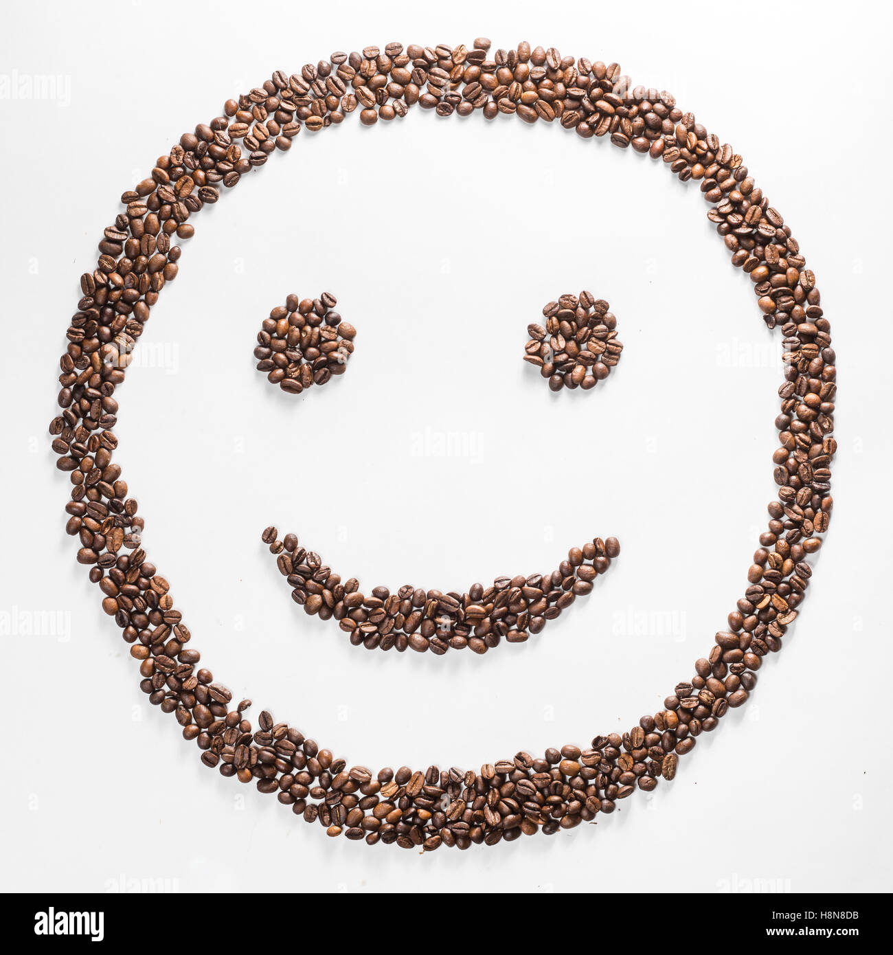 Smile shaped coffee beans isolated on white background. composition for ...