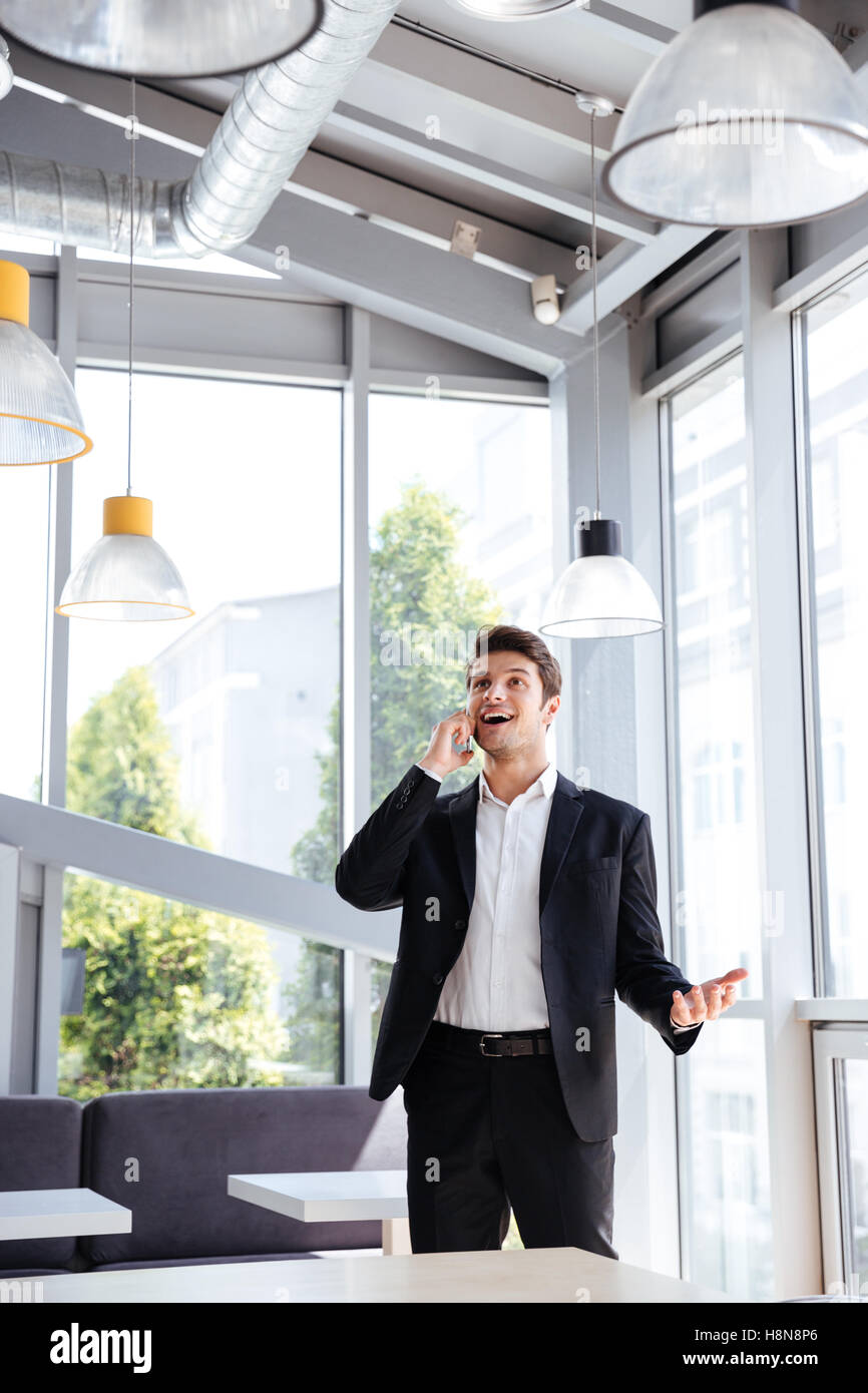 Happy excited young businessman talking hi-res stock photography and ...