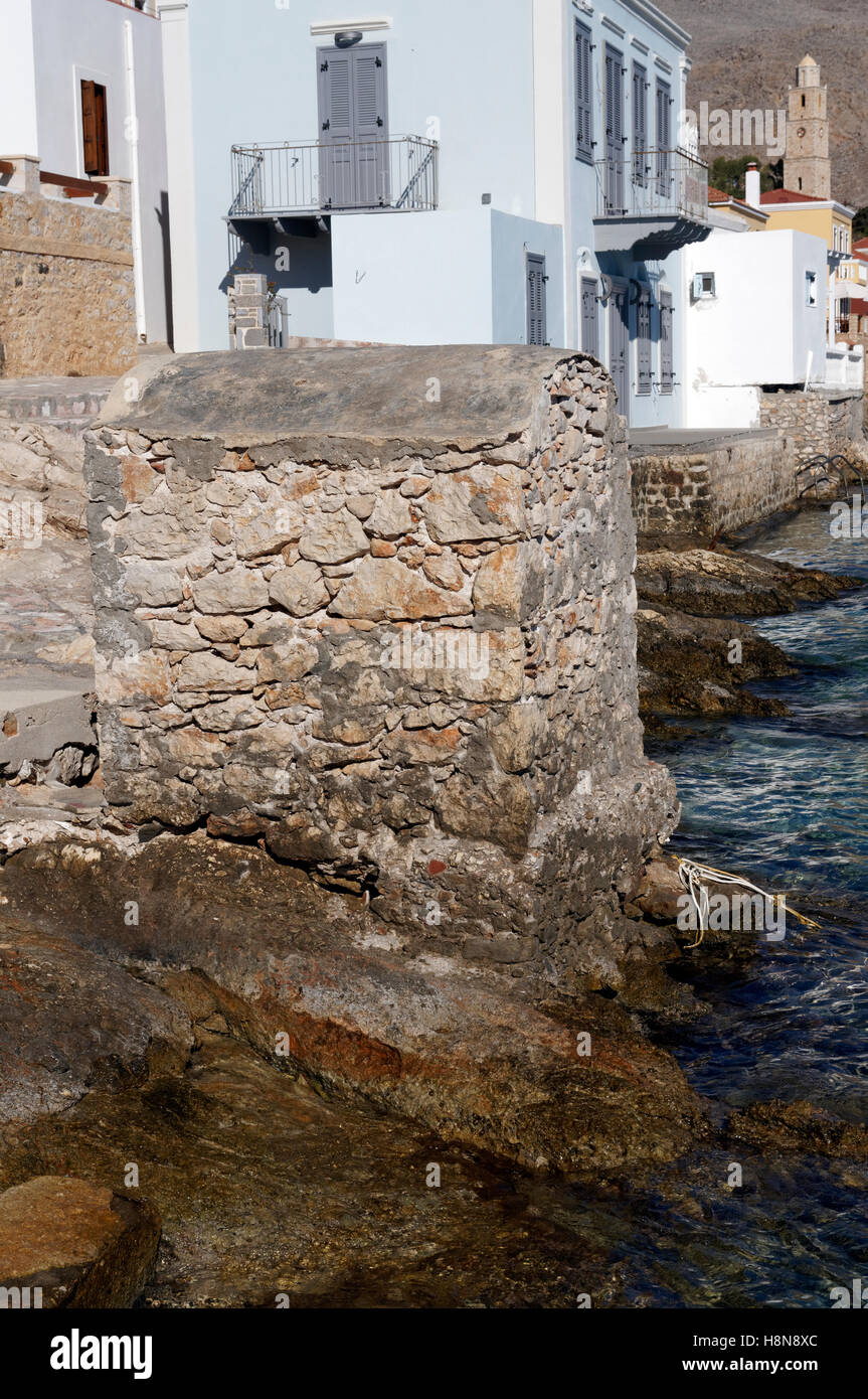 Old disused outside toilet, emptying straight into the harbour, Chalki ...