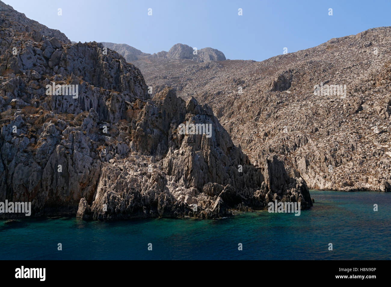 Remote and wild mountain landscape of Chalki Island from the sea near ...