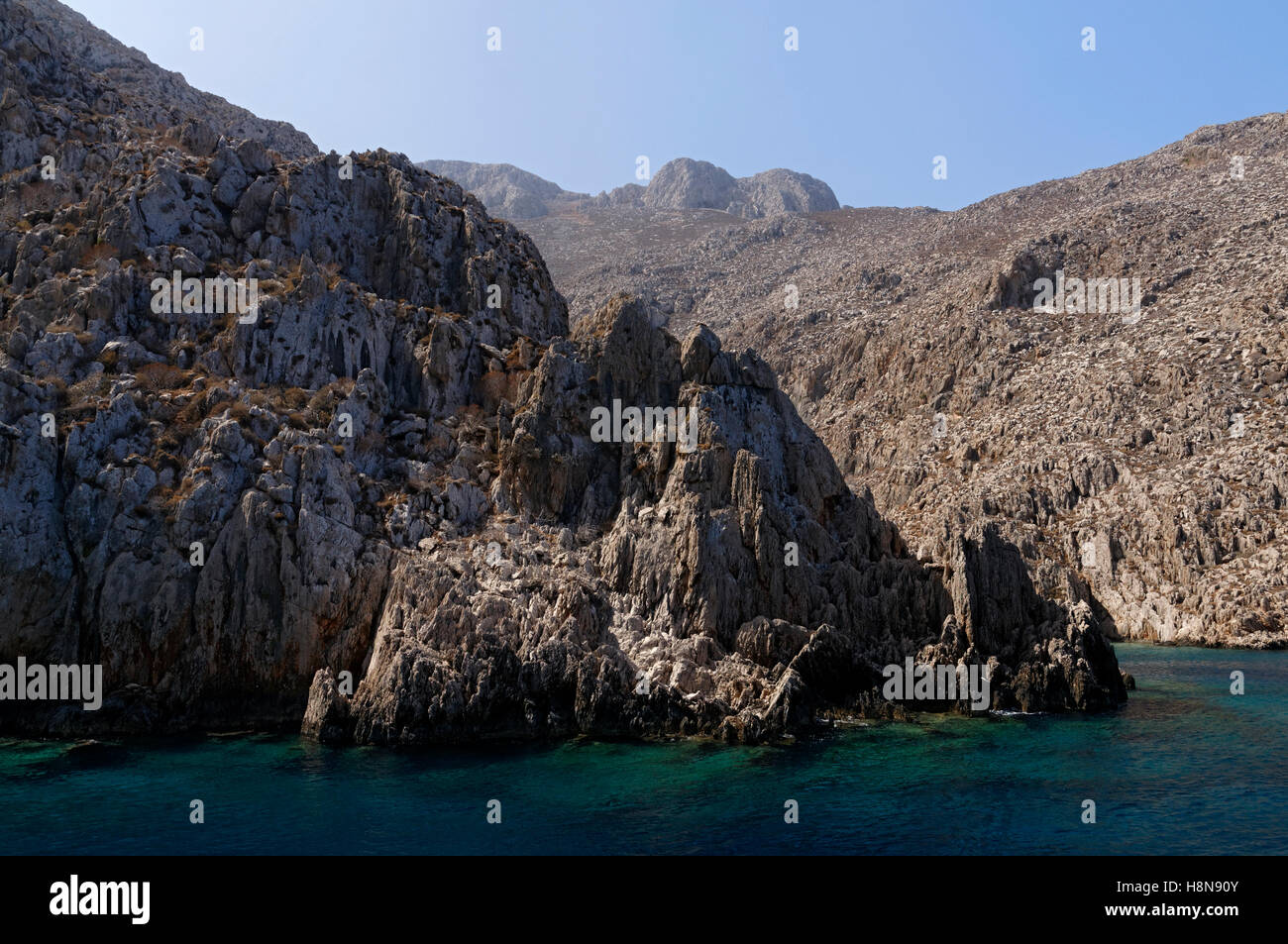 Remote and wild mountain landscape of Chalki Island from the sea near ...