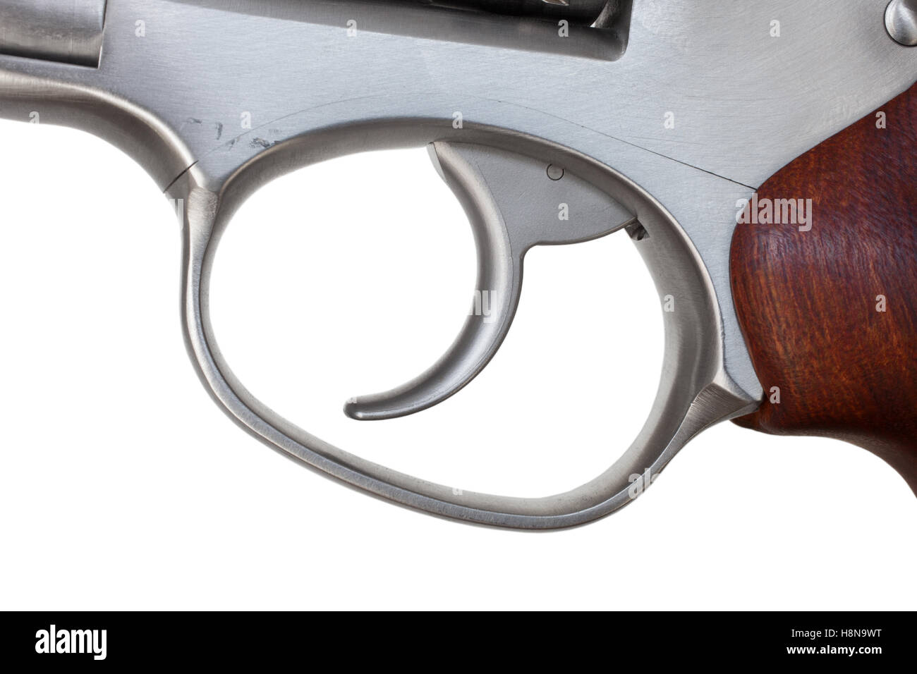 Trigger on a metal revolver isolated on white Stock Photo - Alamy