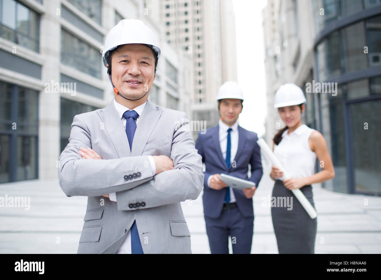 Confident Chinese architects Stock Photo - Alamy