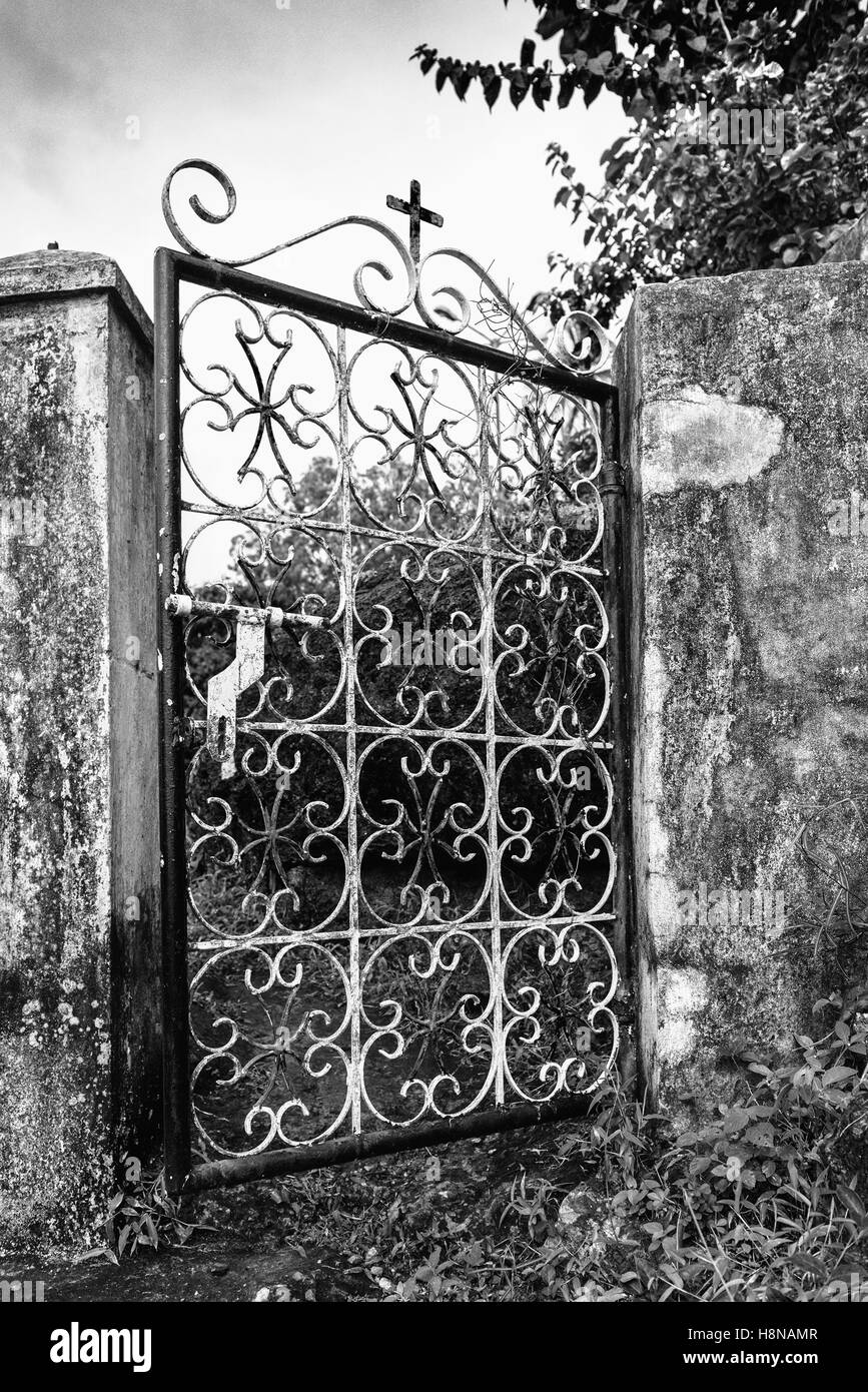 Old metal fence gate with cross in black and white Stock Photo - Alamy