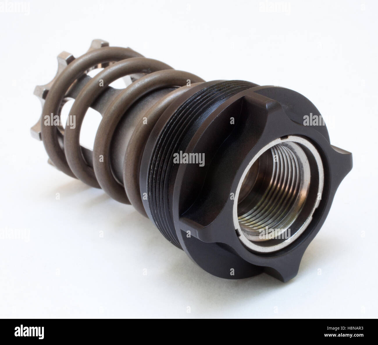 Valve and threads that go on the back of a suppressor Stock Photo - Alamy