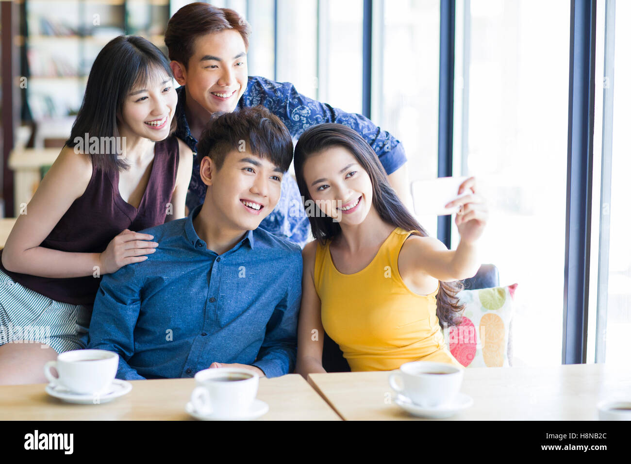 Young Chinese friends taking self portrait with a smart phone Stock ...
