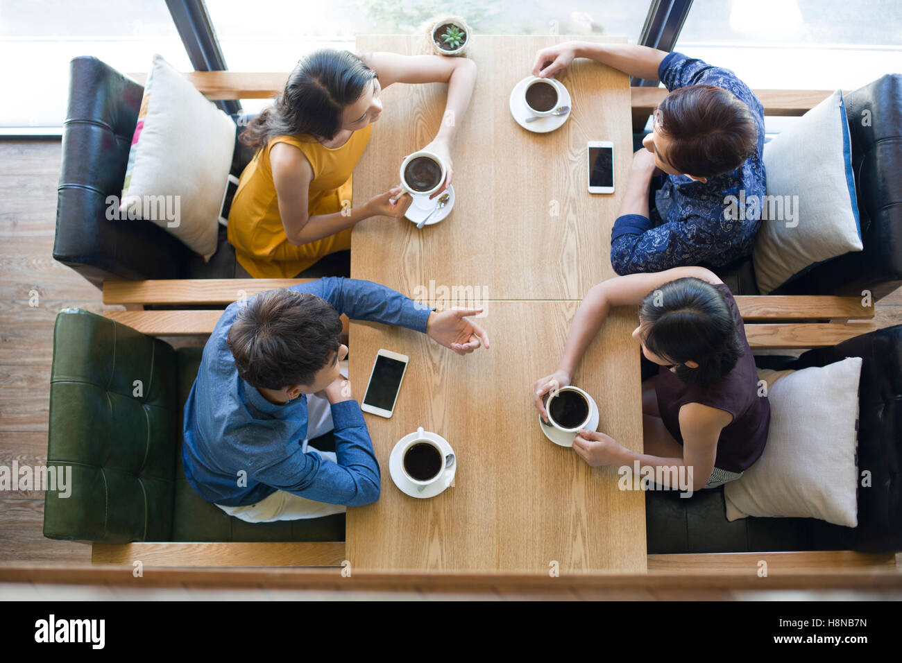 Indian friends at coffee shop hi-res stock photography and images - Alamy