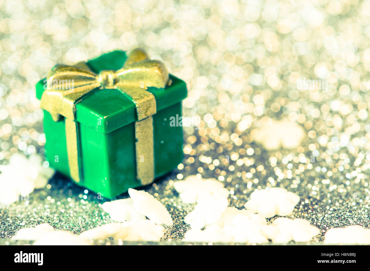 green christmas present with yellow ribbon Stock Photo - Alamy