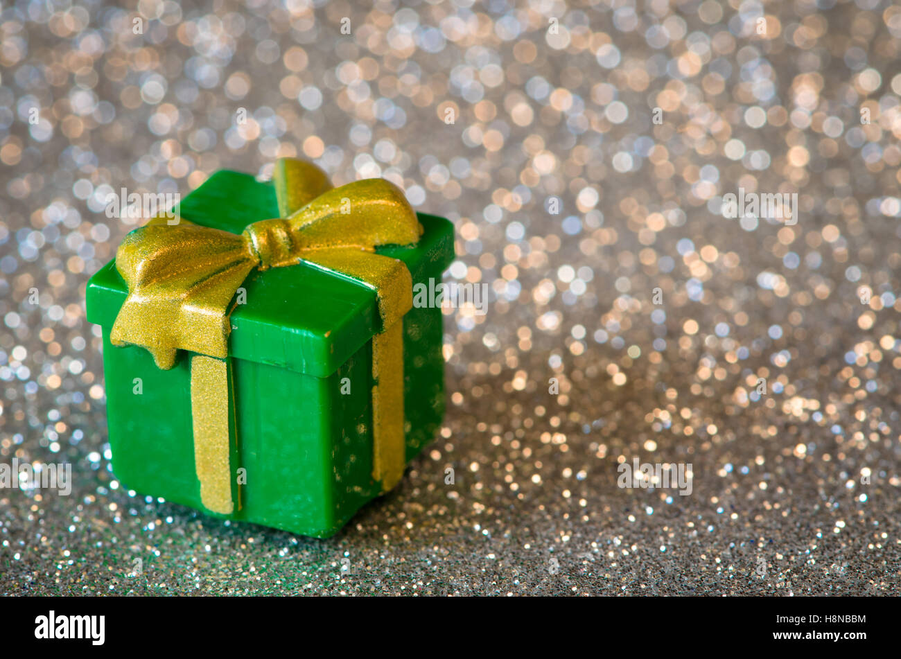 green christmas present with yellow ribbon Stock Photo - Alamy
