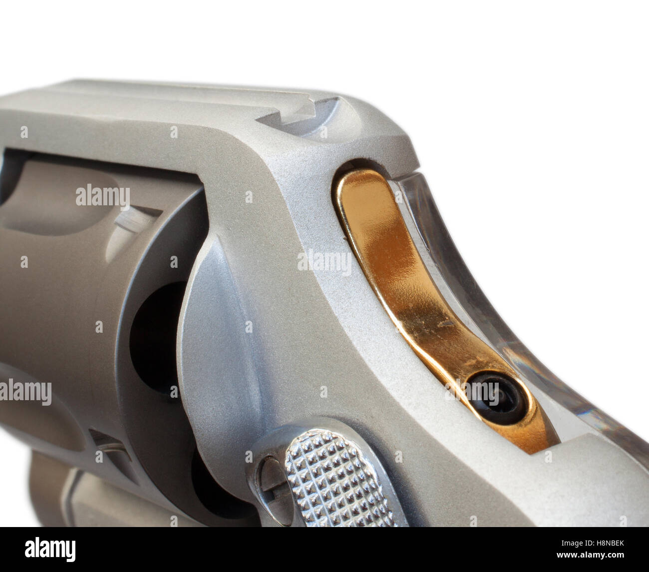 Gold colored hammer on a revolver isolated on white Stock Photo - Alamy