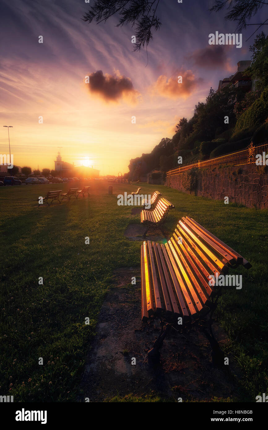benches at sunset reflecting the sunlight Stock Photo - Alamy