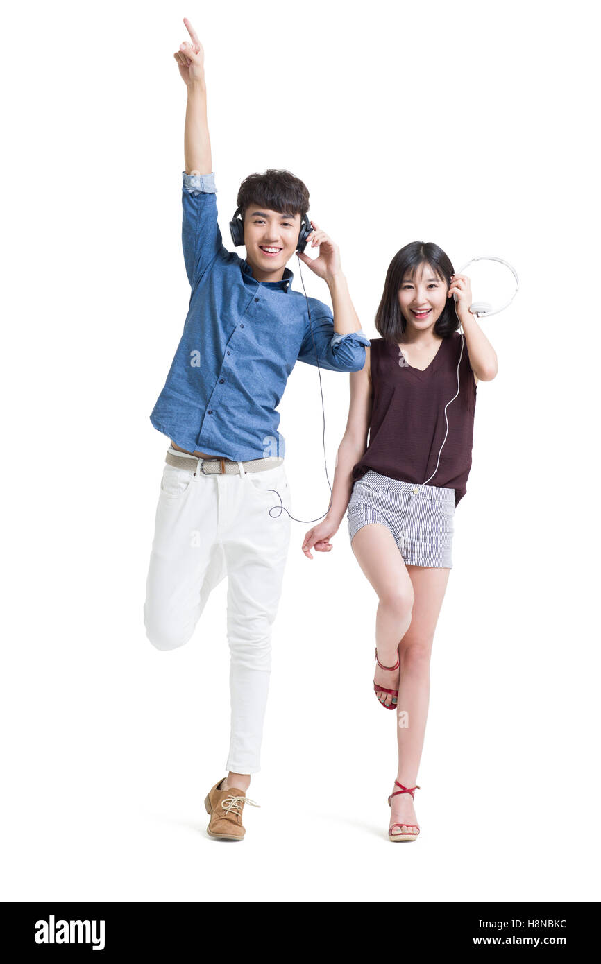 Happy young Chinese couple listening to music Stock Photo - Alamy