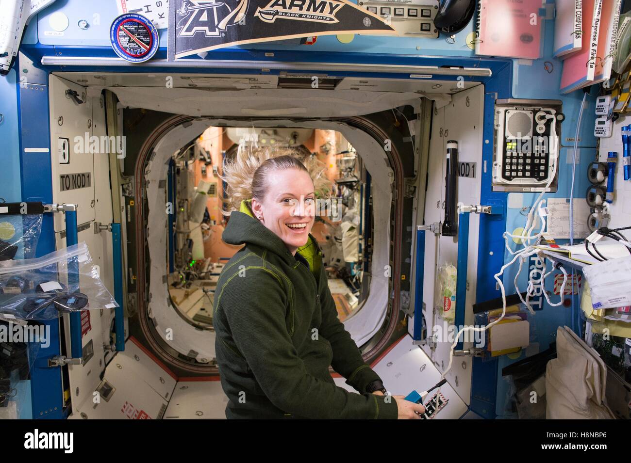 NASA International Space Station astronaut Kate Rubins holds a ...