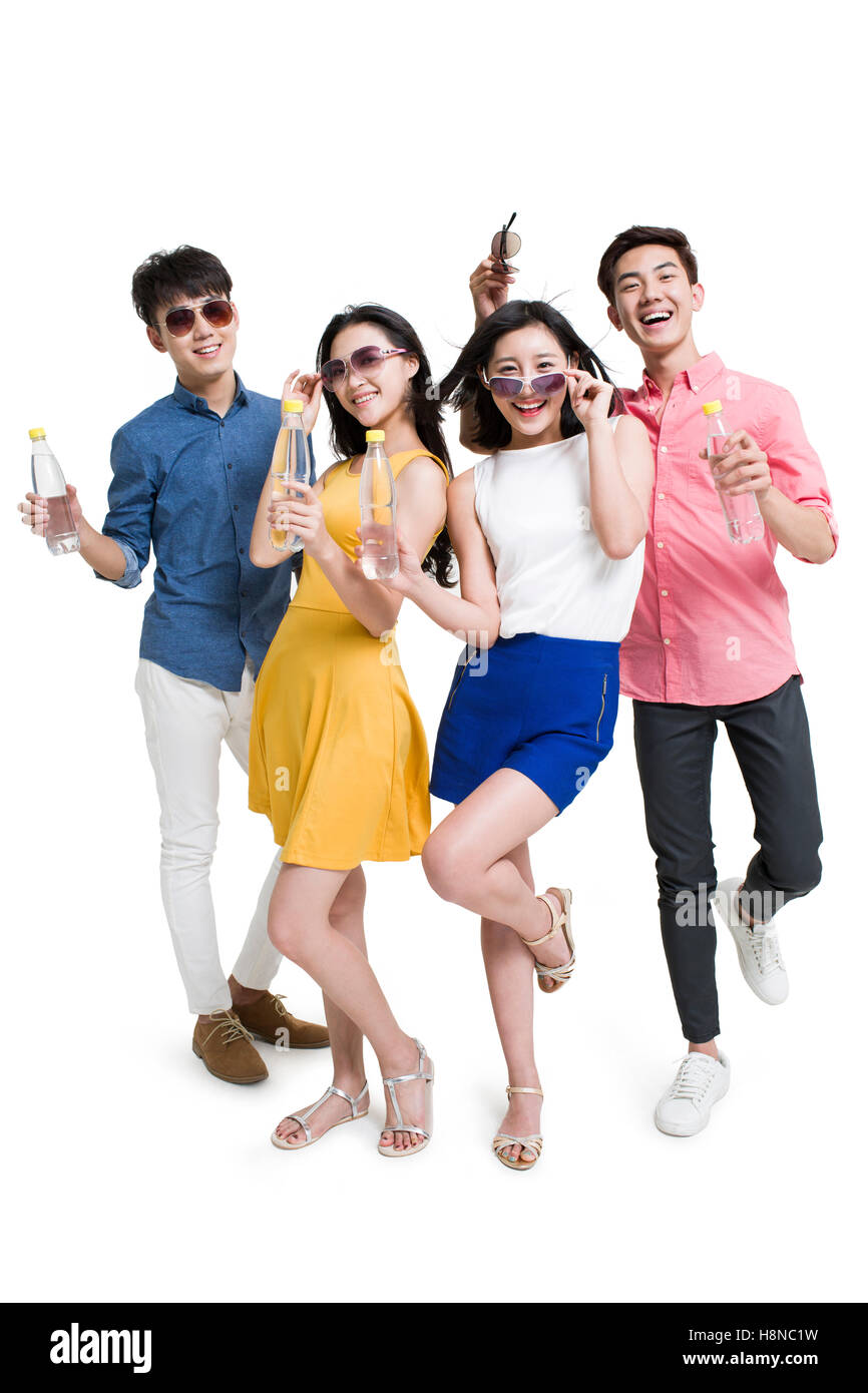 Happy young Chinese friends holding bottles of water Stock Photo - Alamy
