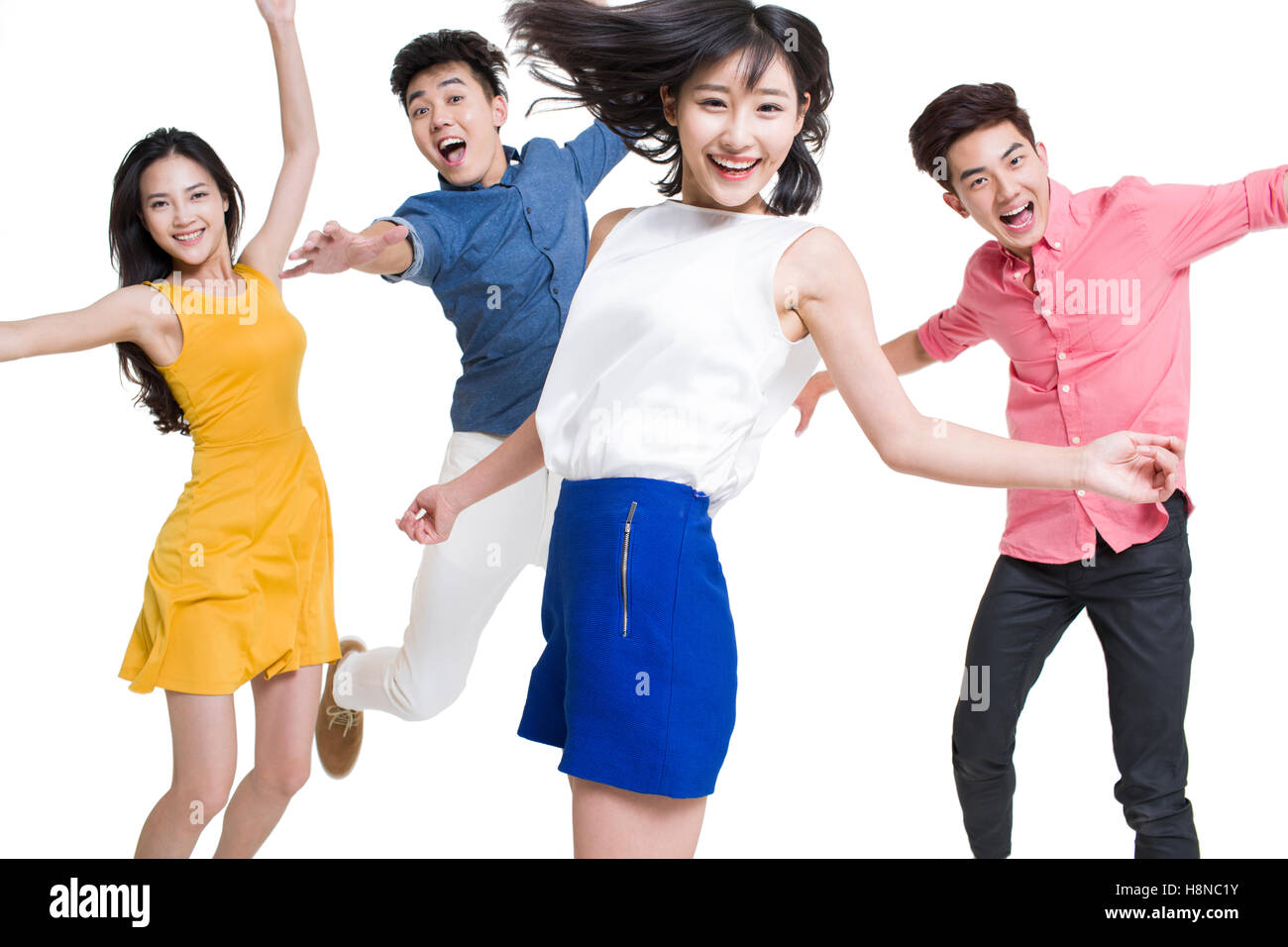 Happy young Chinese friends jumping Stock Photo - Alamy