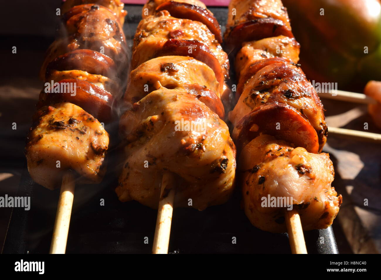 Chicken skewers on a hot grill Stock Photo - Alamy