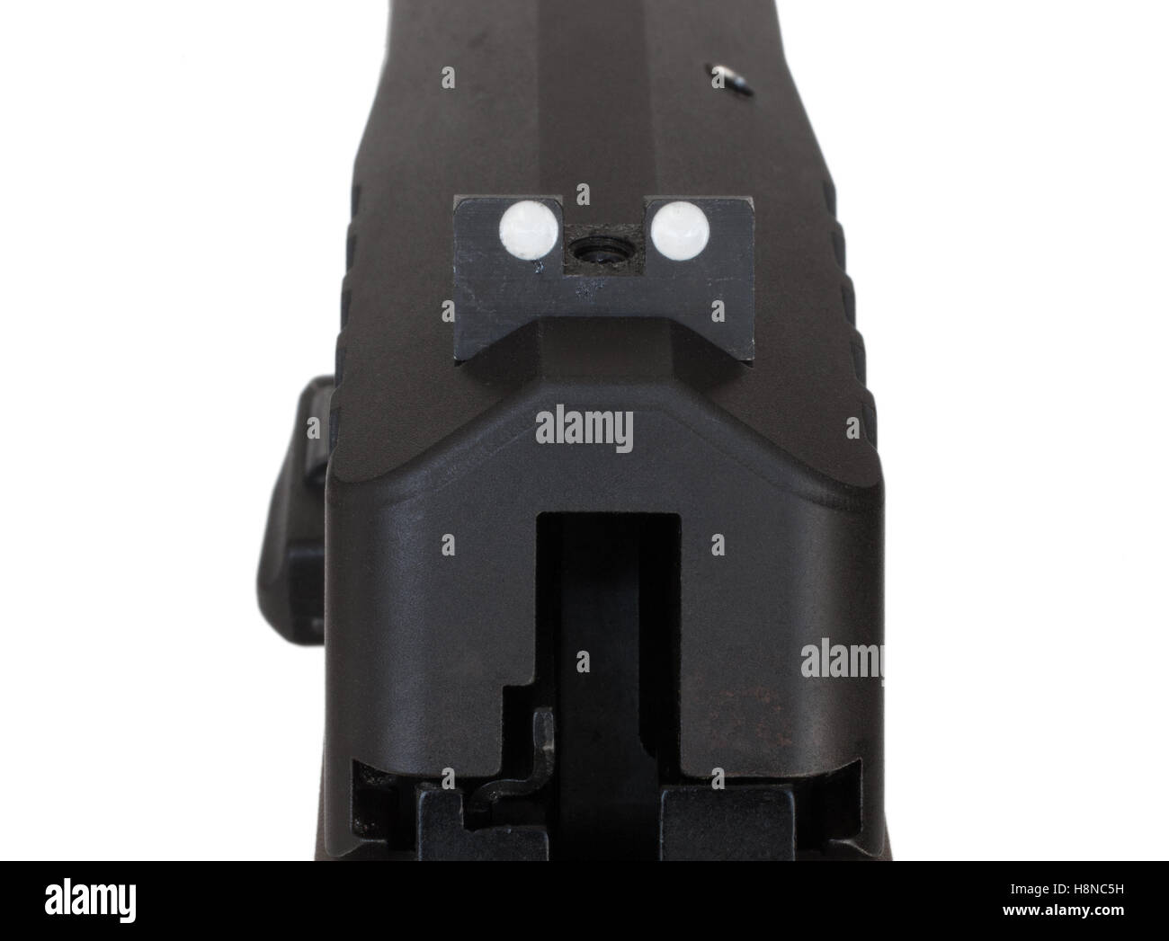 Rear sight on a handgun that has a pair of white dots Stock Photo - Alamy