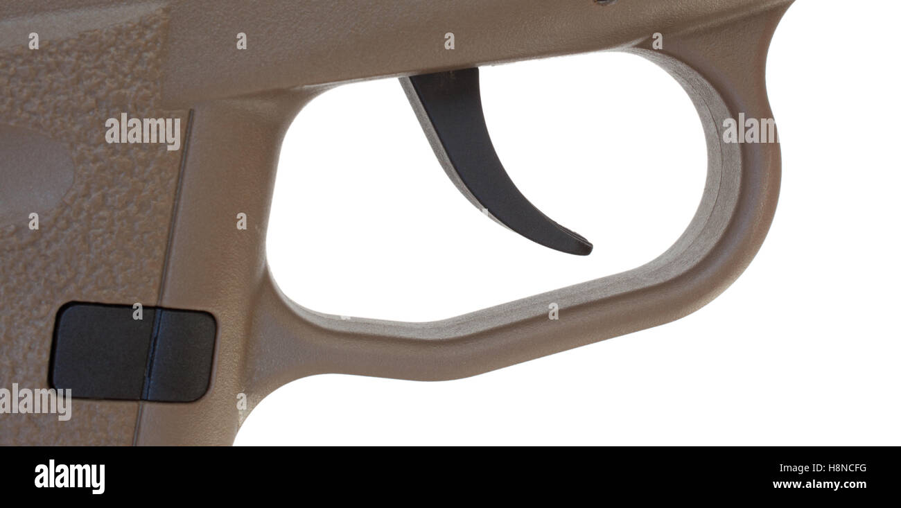 Trigger on a brown polymer handgun isolated on white Stock Photo - Alamy