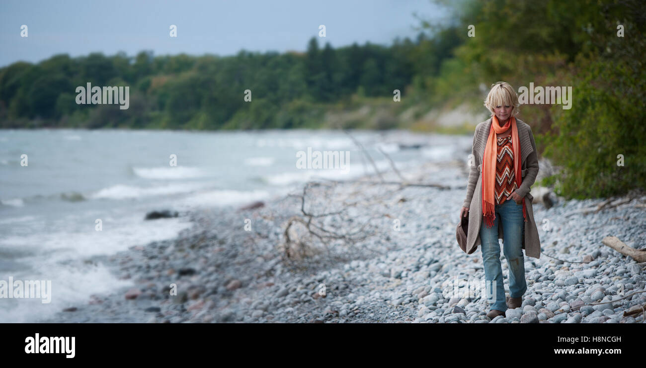 Woman walking alone hi-res stock photography and images - Alamy