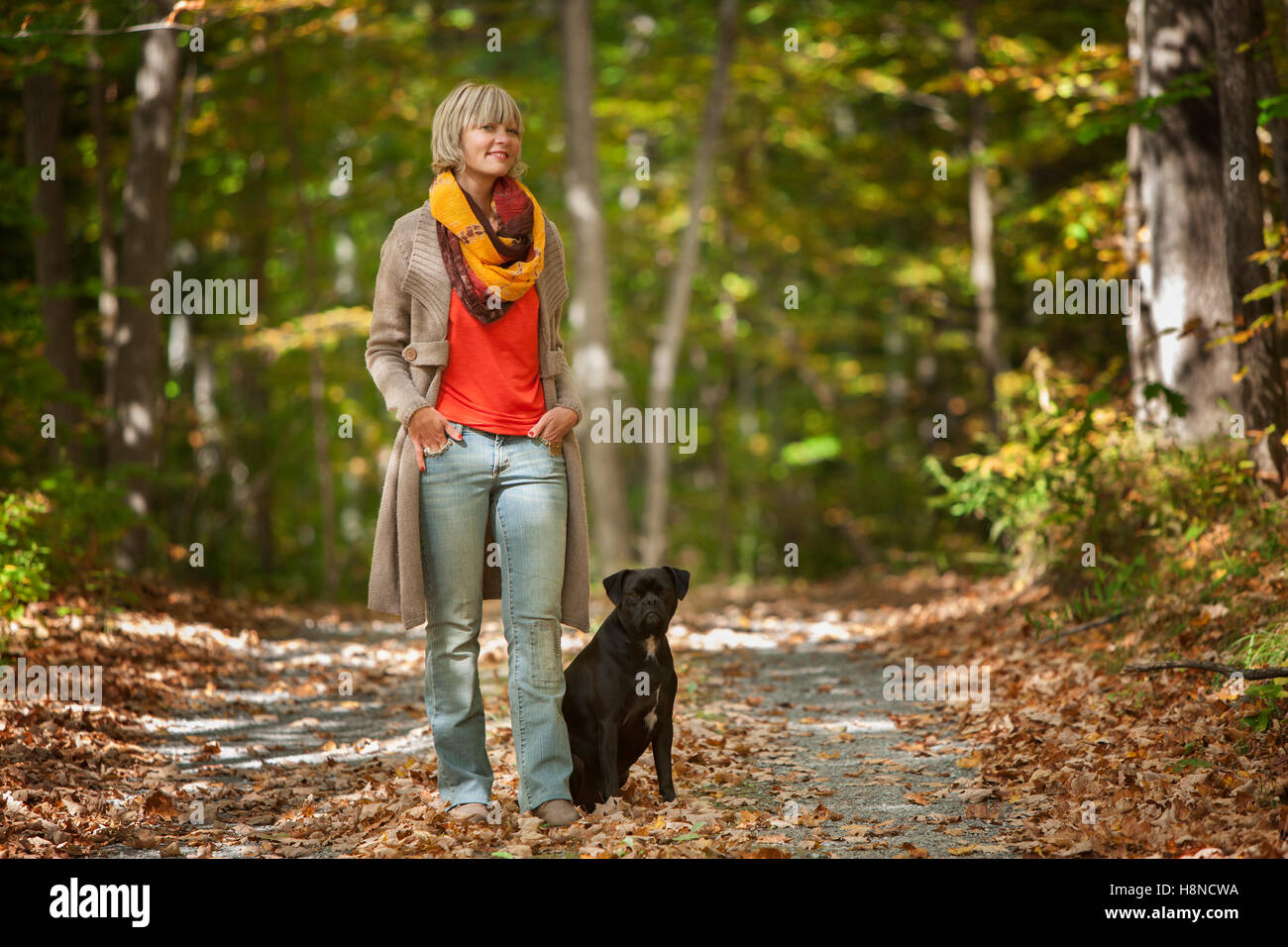 Woman and her dog outside in Autumn Stock Photo - Alamy
